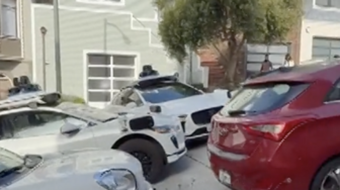 Driverless Waymo cars block San Francisco street viral clip ...